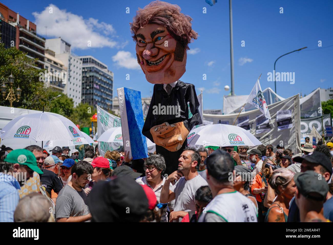 An effigy of Argentina's President Javier Milei stands over protesters ...
