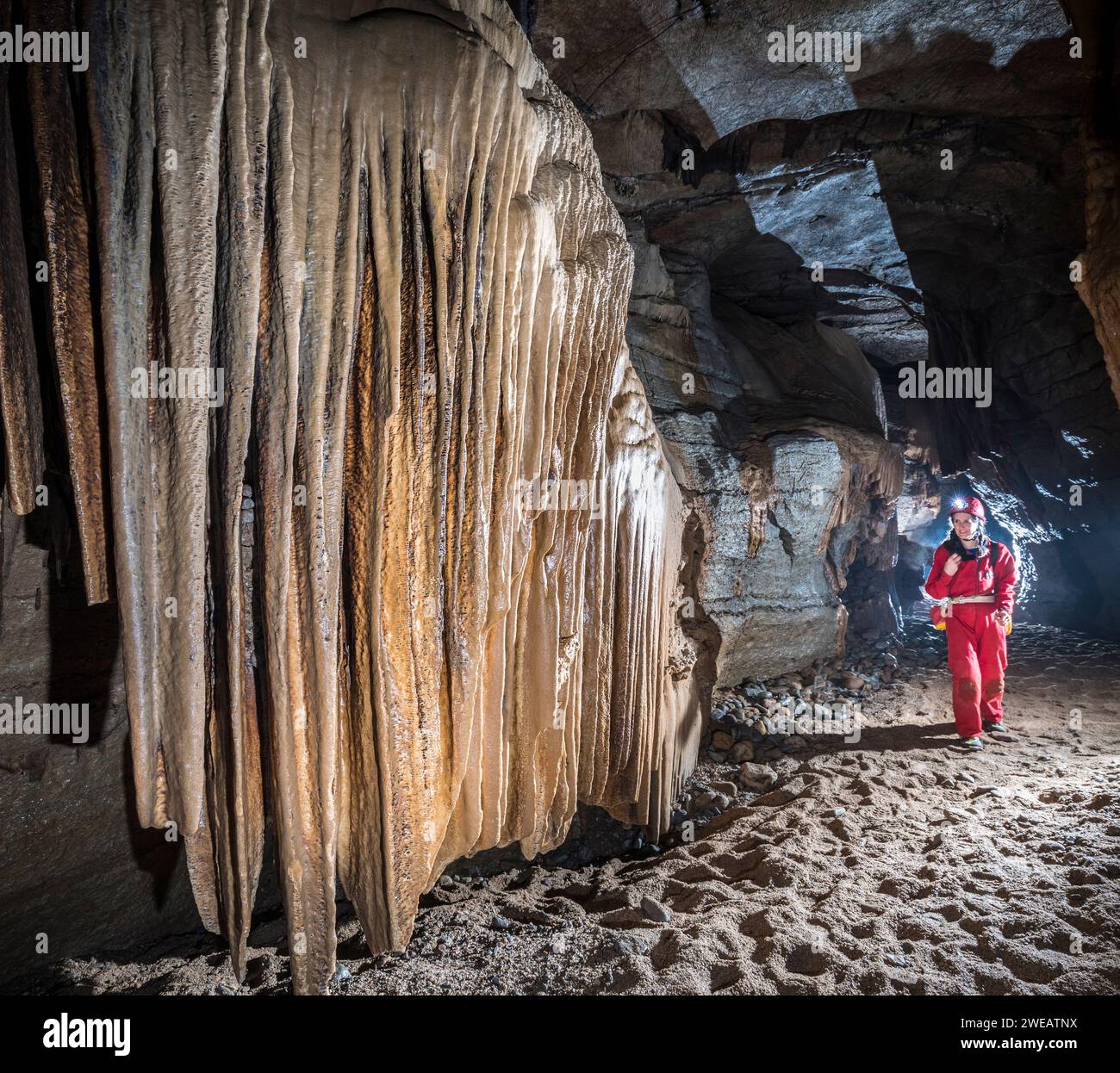 Female caver with formations in the Grotte de la Cocalière; Ardeche ...