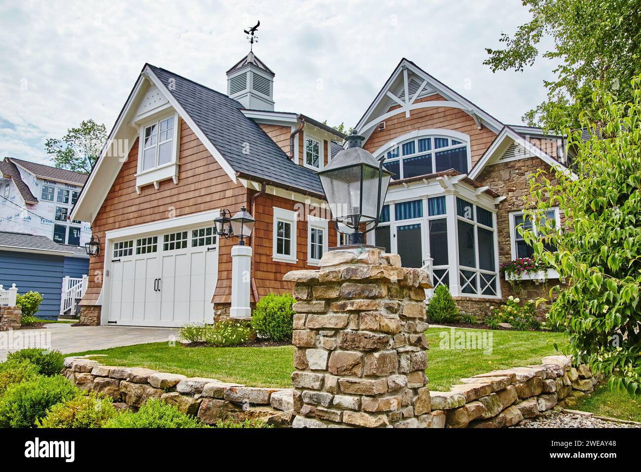 Luxurious House with Gable Roofs and Manicured Lawn, Eye-Level View ...