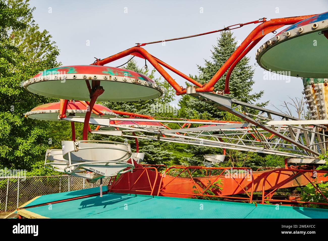 Colorful Abandoned Scrambler Ride with Rustic Charm, Eye-Level View ...