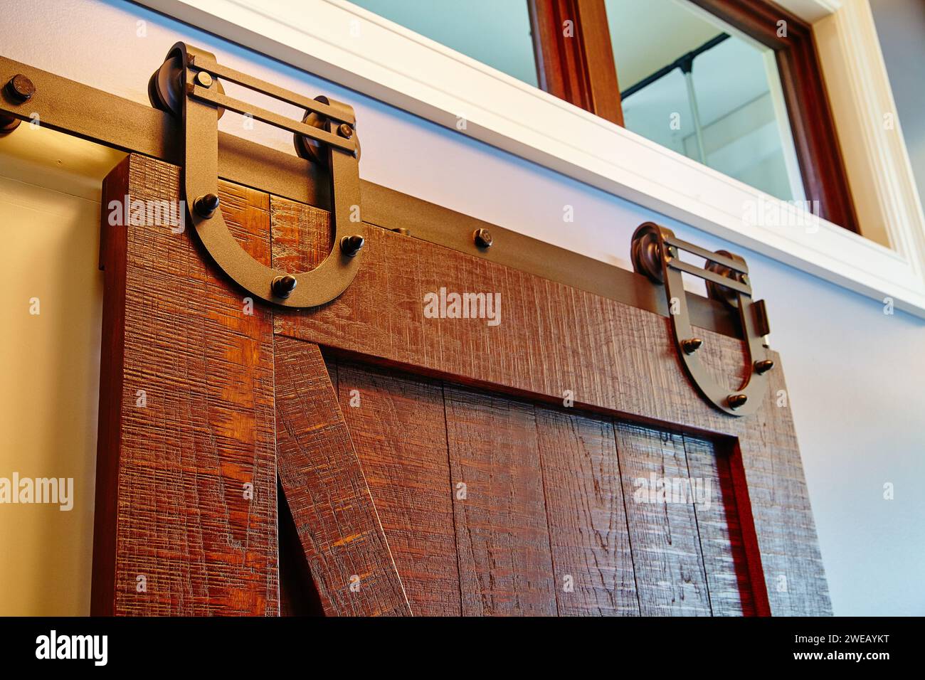 Rustic Sliding Barn Door with Metal Hardware Detail Stock Photo - Alamy