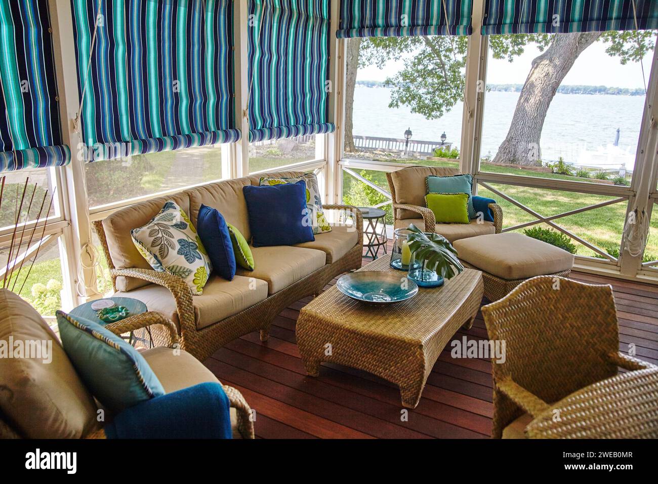 Lakeside Screened Porch with Wicker Furniture and Water View Stock ...