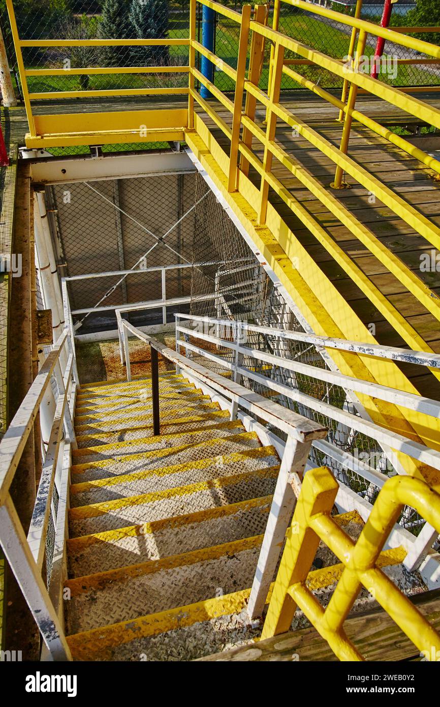 Vibrant Industrial Staircase with Yellow Rails and Metal Steps ... Vibrant Industrial Staircase with Yellow Rails and Metal Steps ...