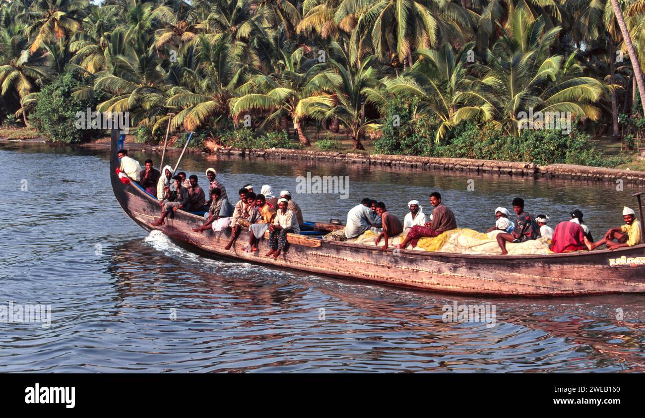 Rural India large traditional wooden boat with passengers Kerala canals ...