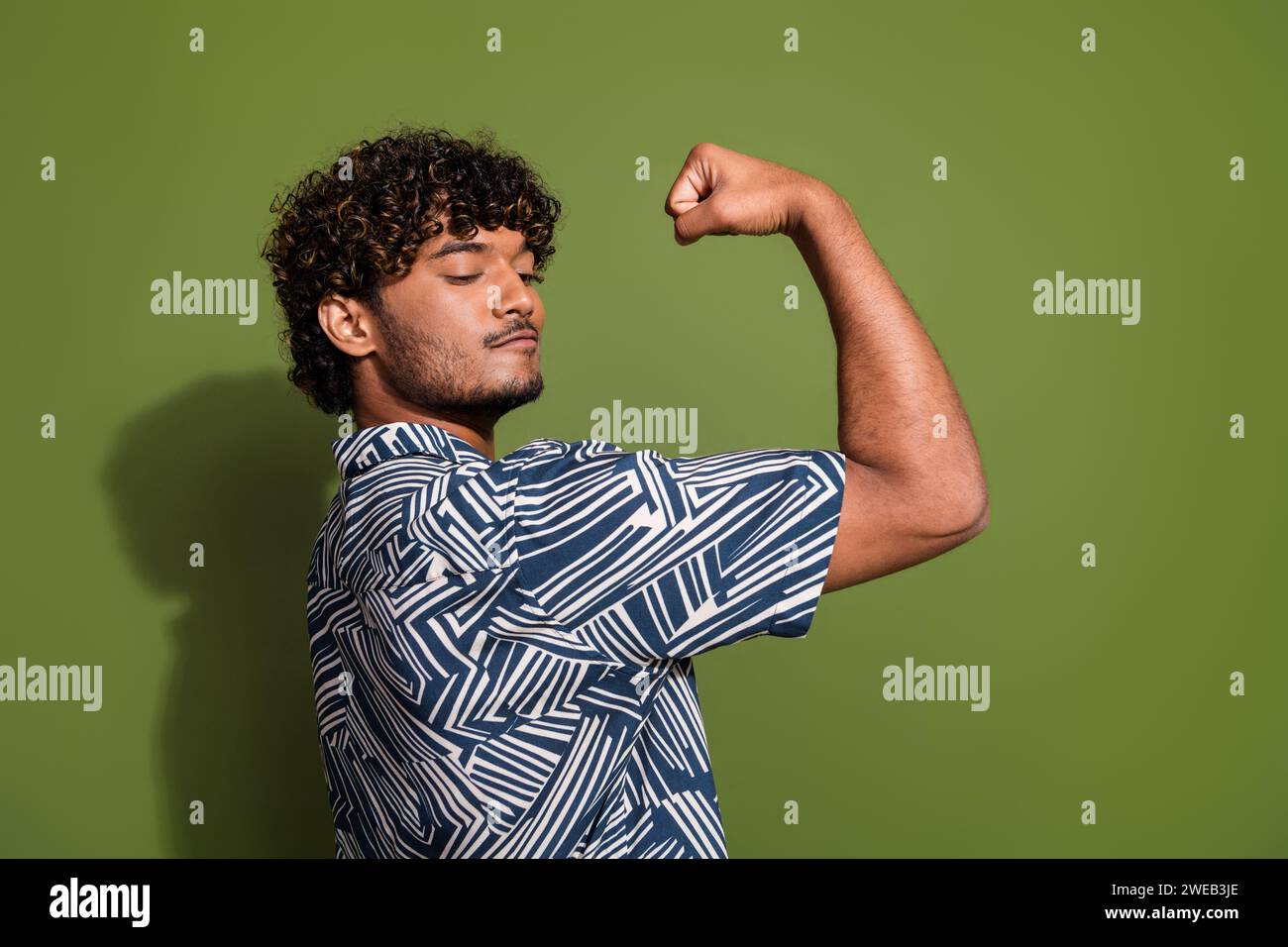 Profile photo of young successful worker indian man showing his arm ...