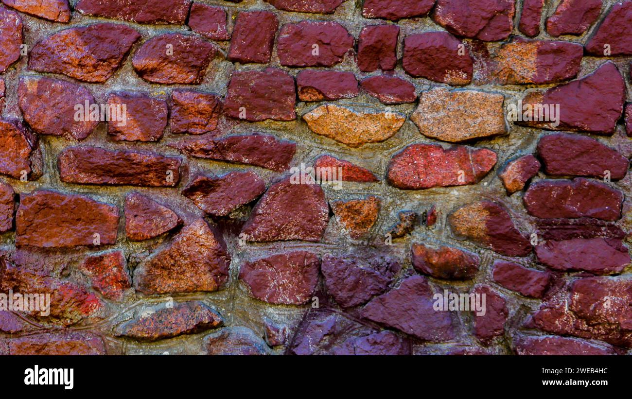 Abstract background of a multi-colored stone wall Stock Photo - Alamy