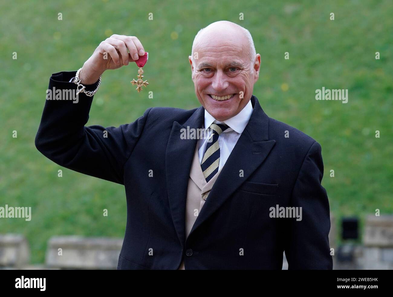 Simon Daglish poses with the medal after being made an Officer of the ...