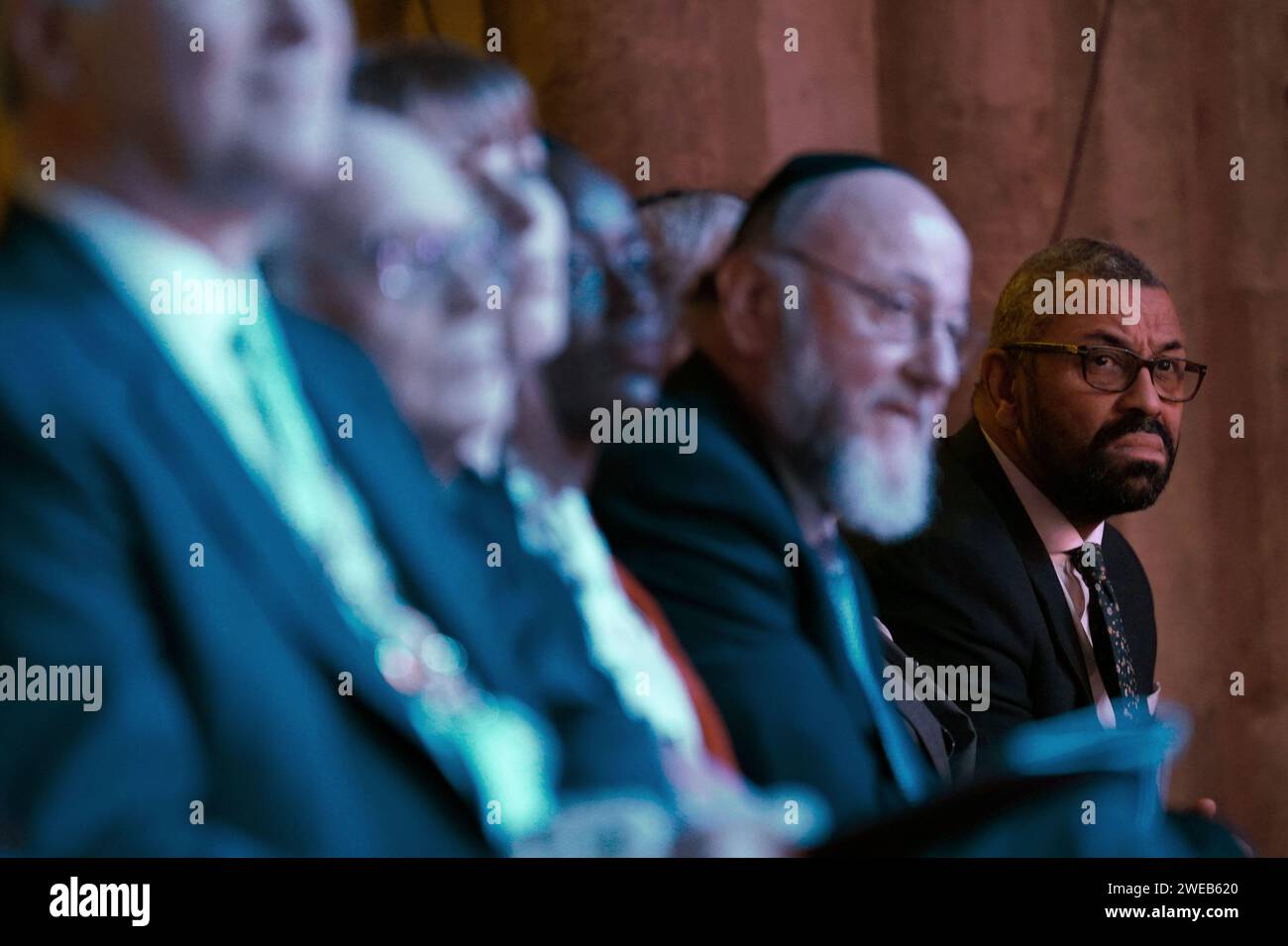 Chief Rabbi Ephraim Mirvis (centre right) and Home Secretary James ...