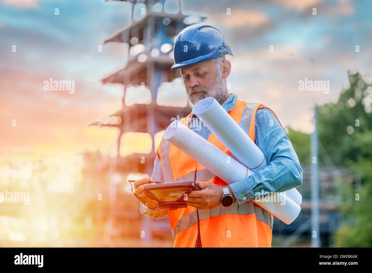 A man site engineer surveyor working with theodolite total station EDM ...