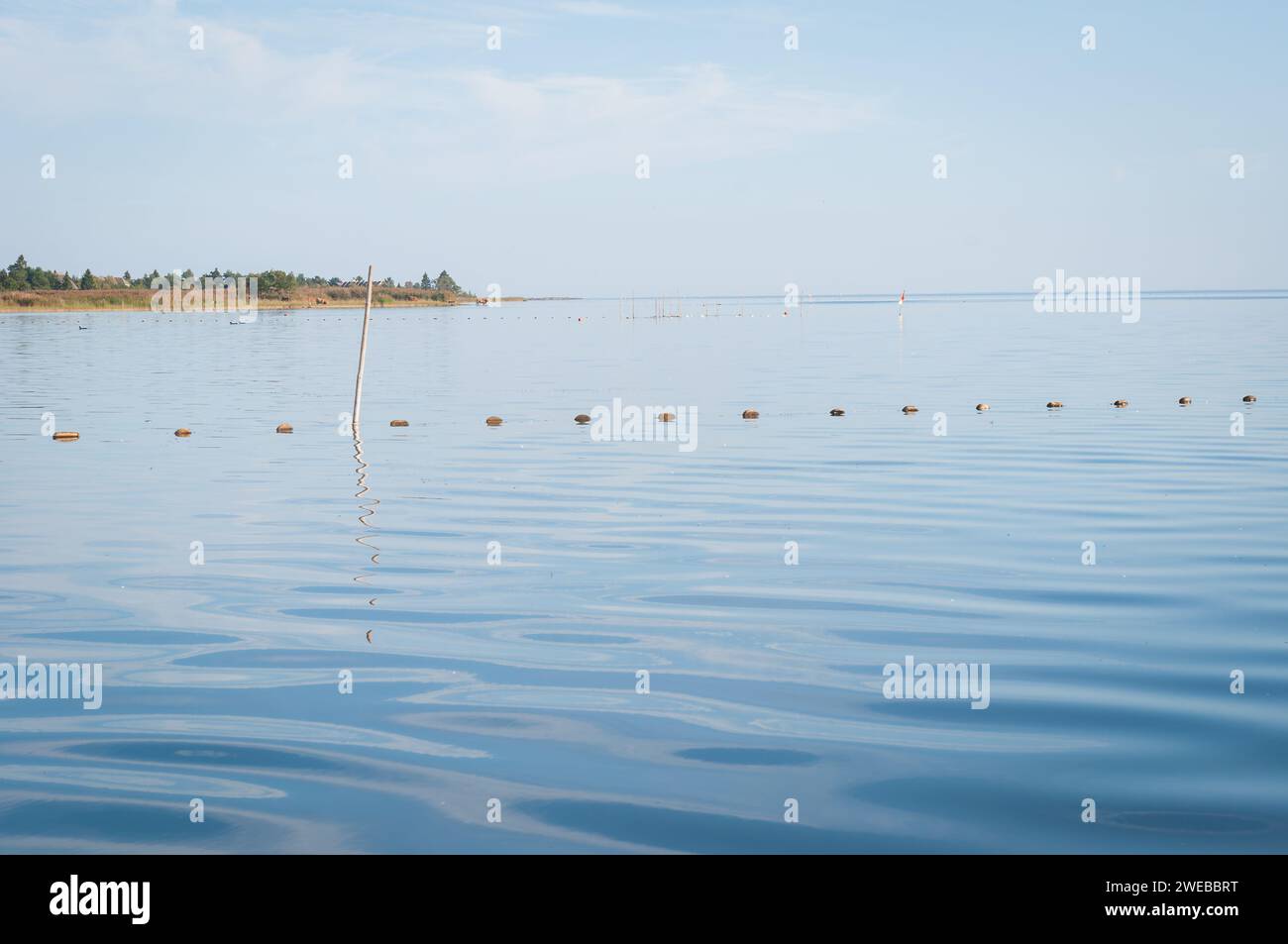 Fishing net, a fish-trap in the sea. Seascape. Summer time. Life on the ...