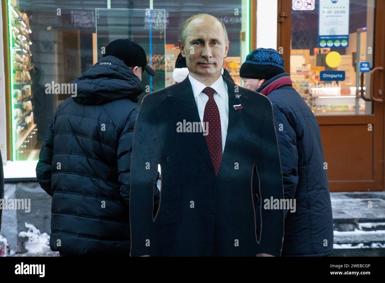 Moscow, Russia. 21st of January, 2024. Men stand next to cardboard ...