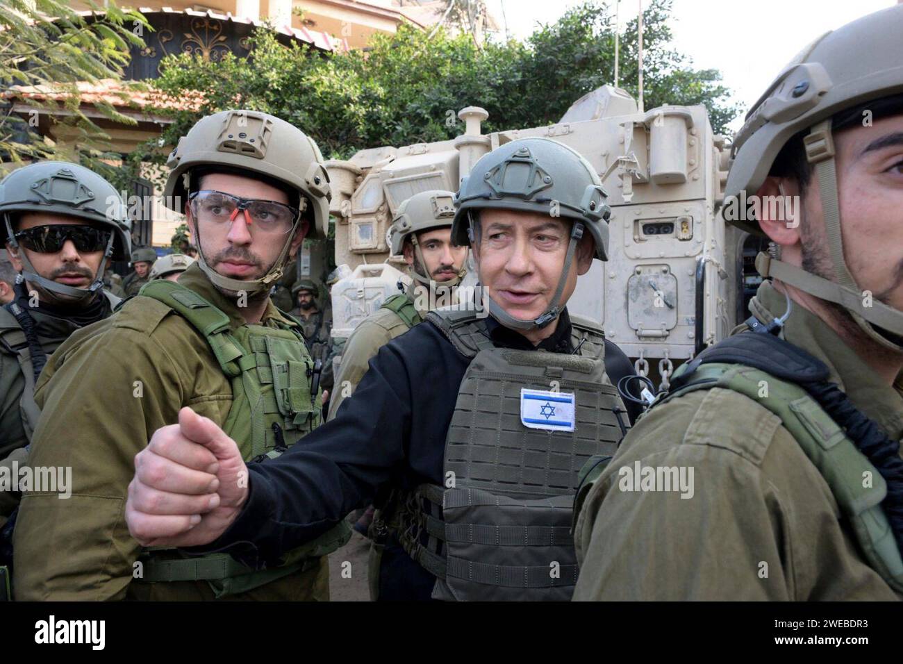 FILE - Israeli Prime Minister Benjamin Netanyahu, center, wears a ...