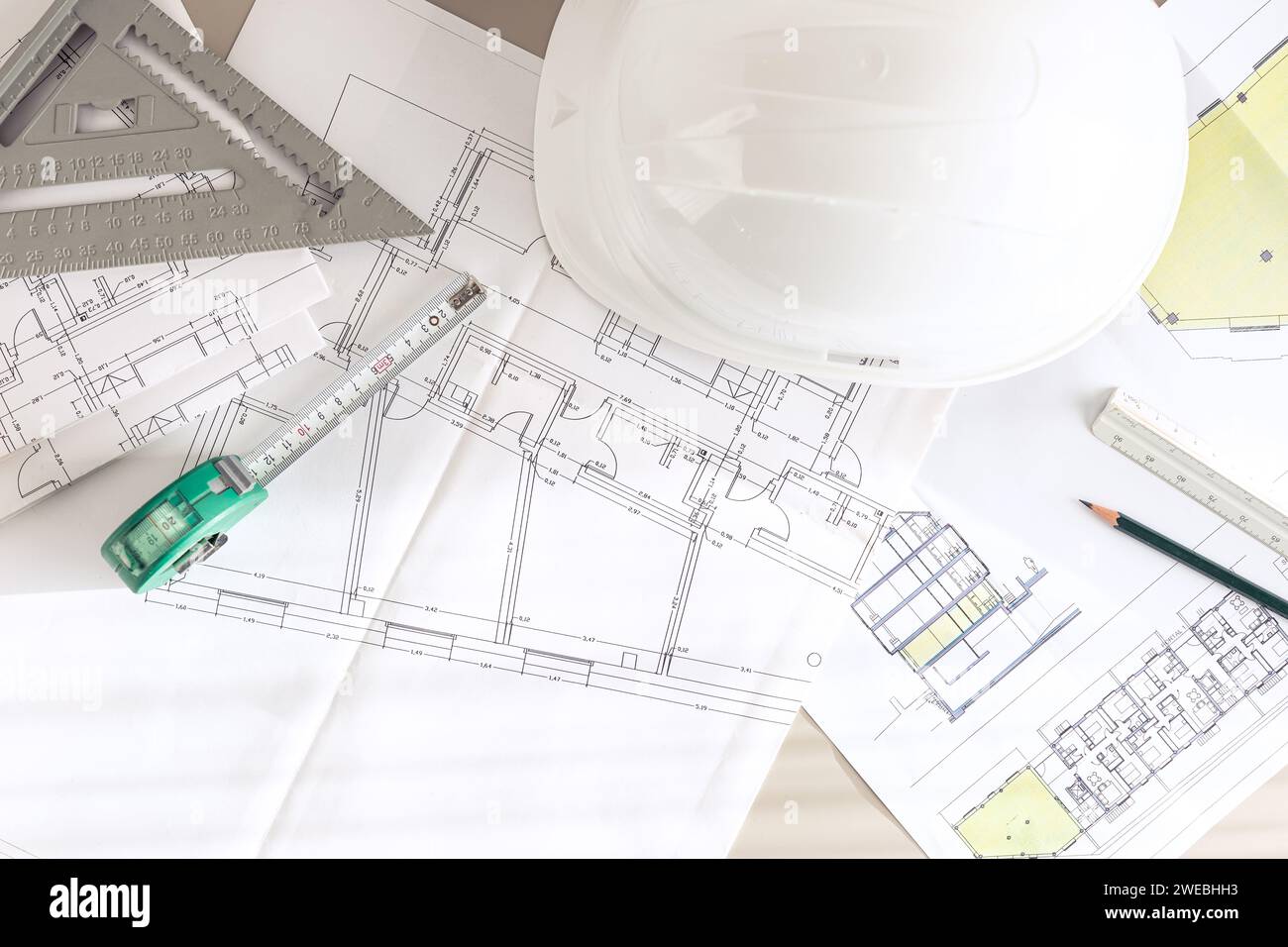 Architecture plans and contractor supplies on desk. Top view Stock ...