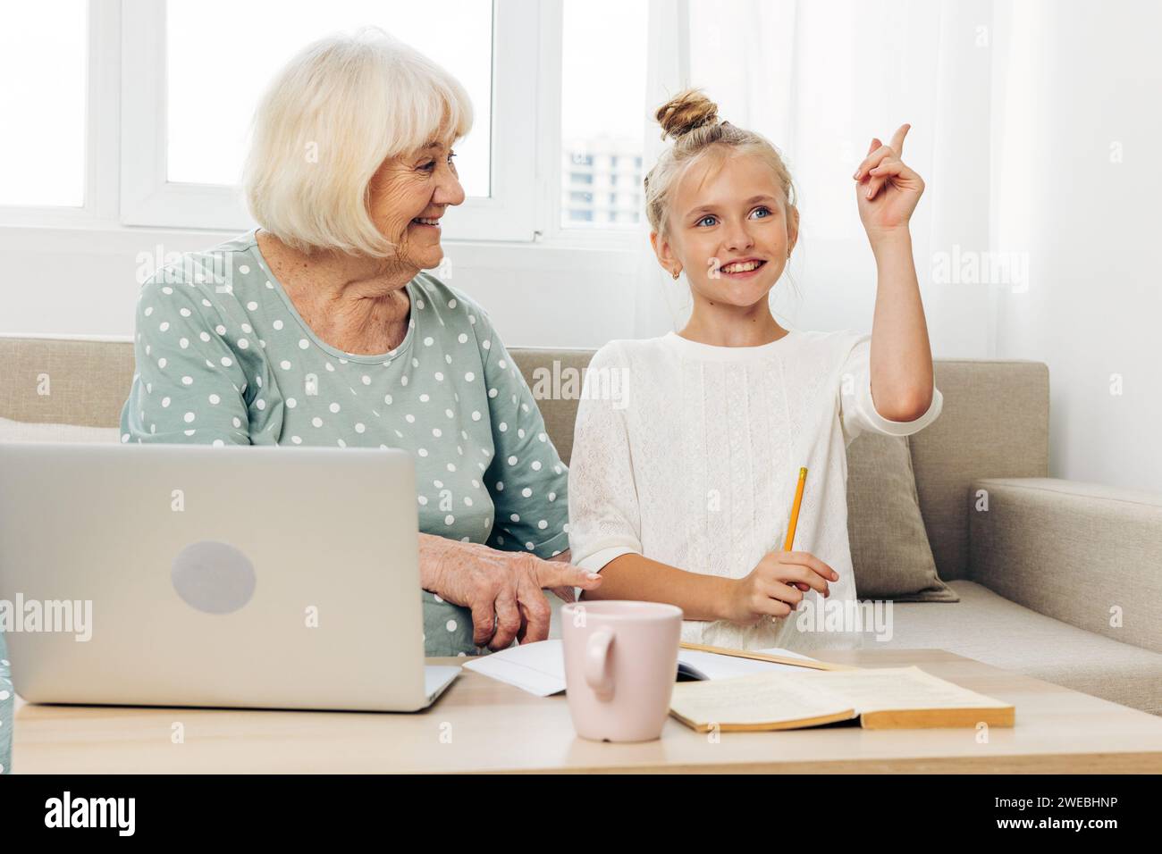 Child grandmother laptop bonding hugging family Stock Photo - Alamy