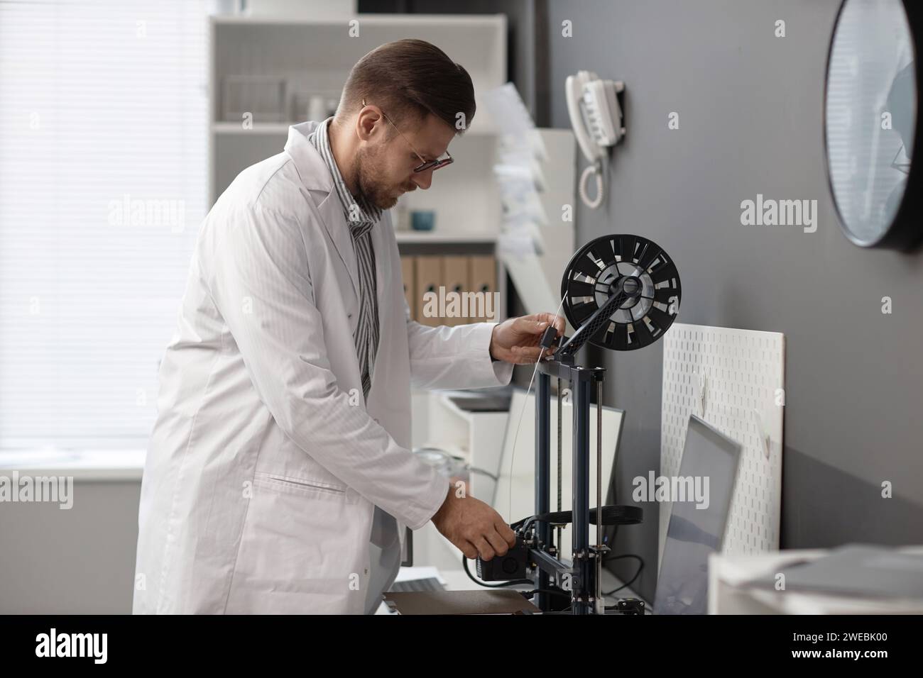 Technician Setting up 3D Printer Stock Photo - Alamy