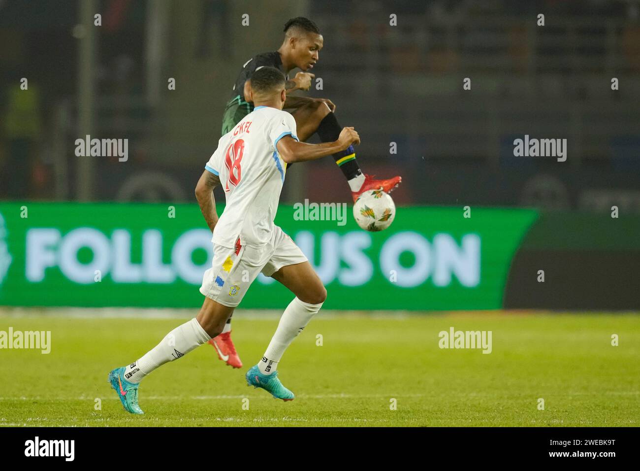 Tanzania's Novatus Dismas, top, challenges for the ball with DR Congo's ...