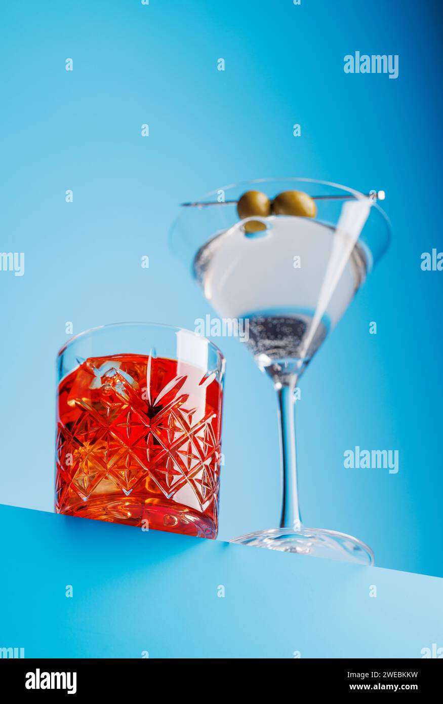 Cocktail delight: Vibrant drinks against a cool blue background with ...