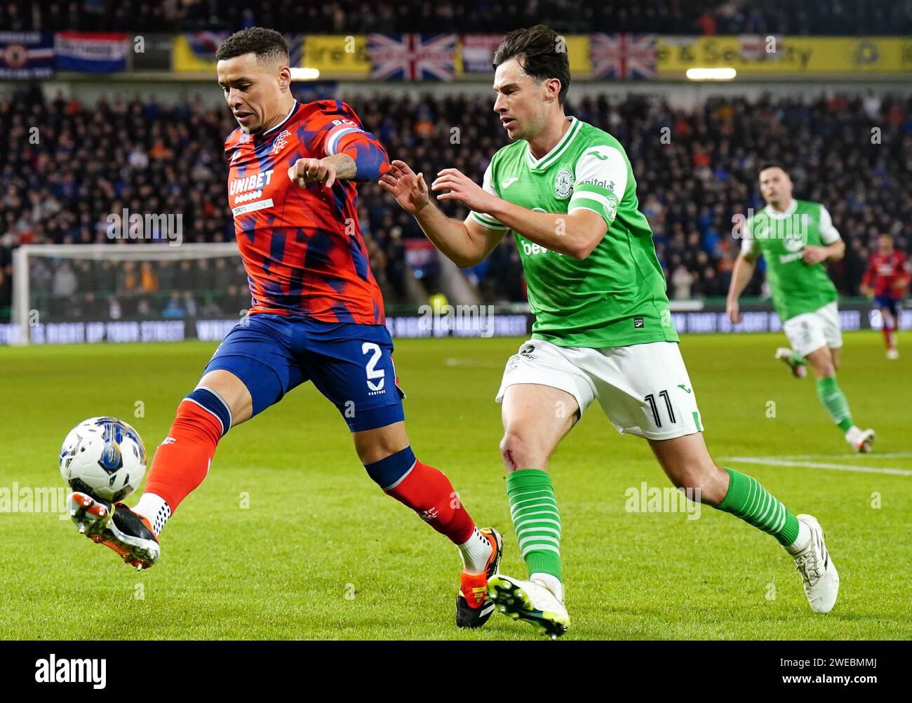 Rangers' James Tavernier (left) and Hibernian's Joe Newell battle for ...