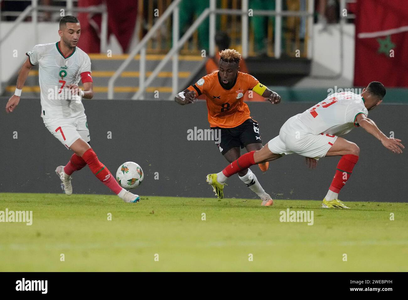 Zambia's Lubambo Musonda, center, challenges for ball with Morocco's ...