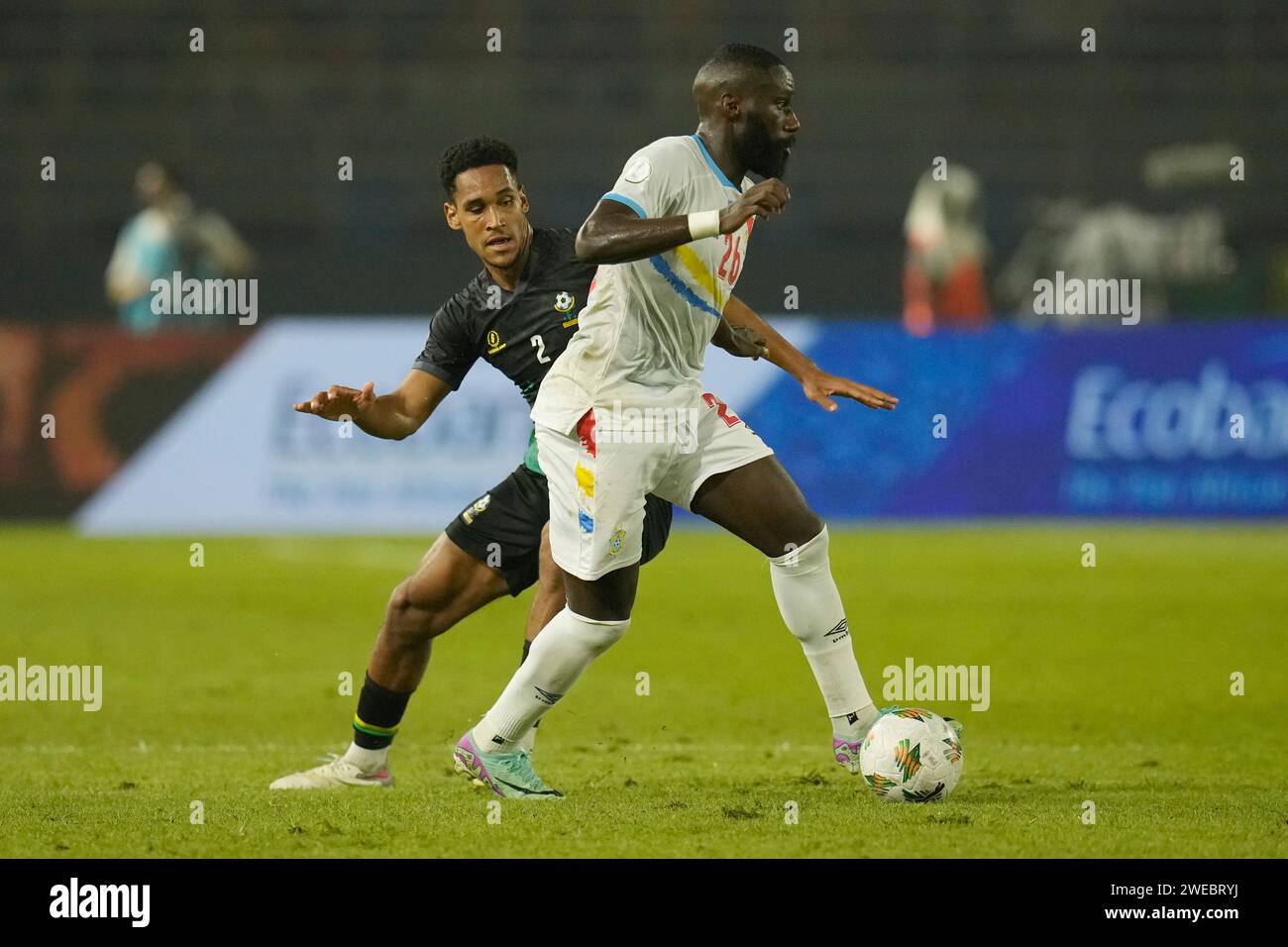 Tanzania's Haji Mnoga, left, challenges for the ball with DR Congo's ...