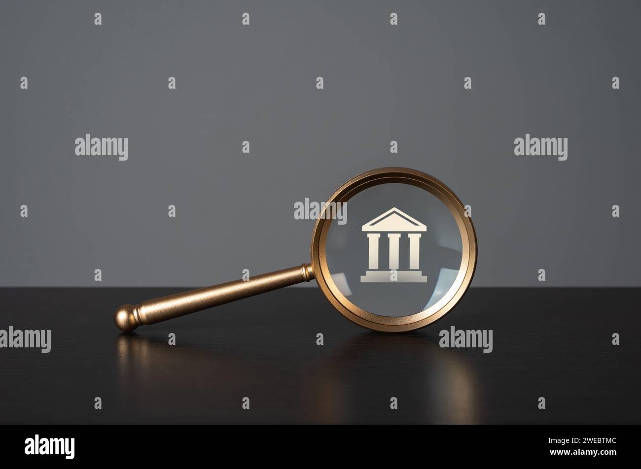 Magnifying glass and courthouse, college, university or government ...