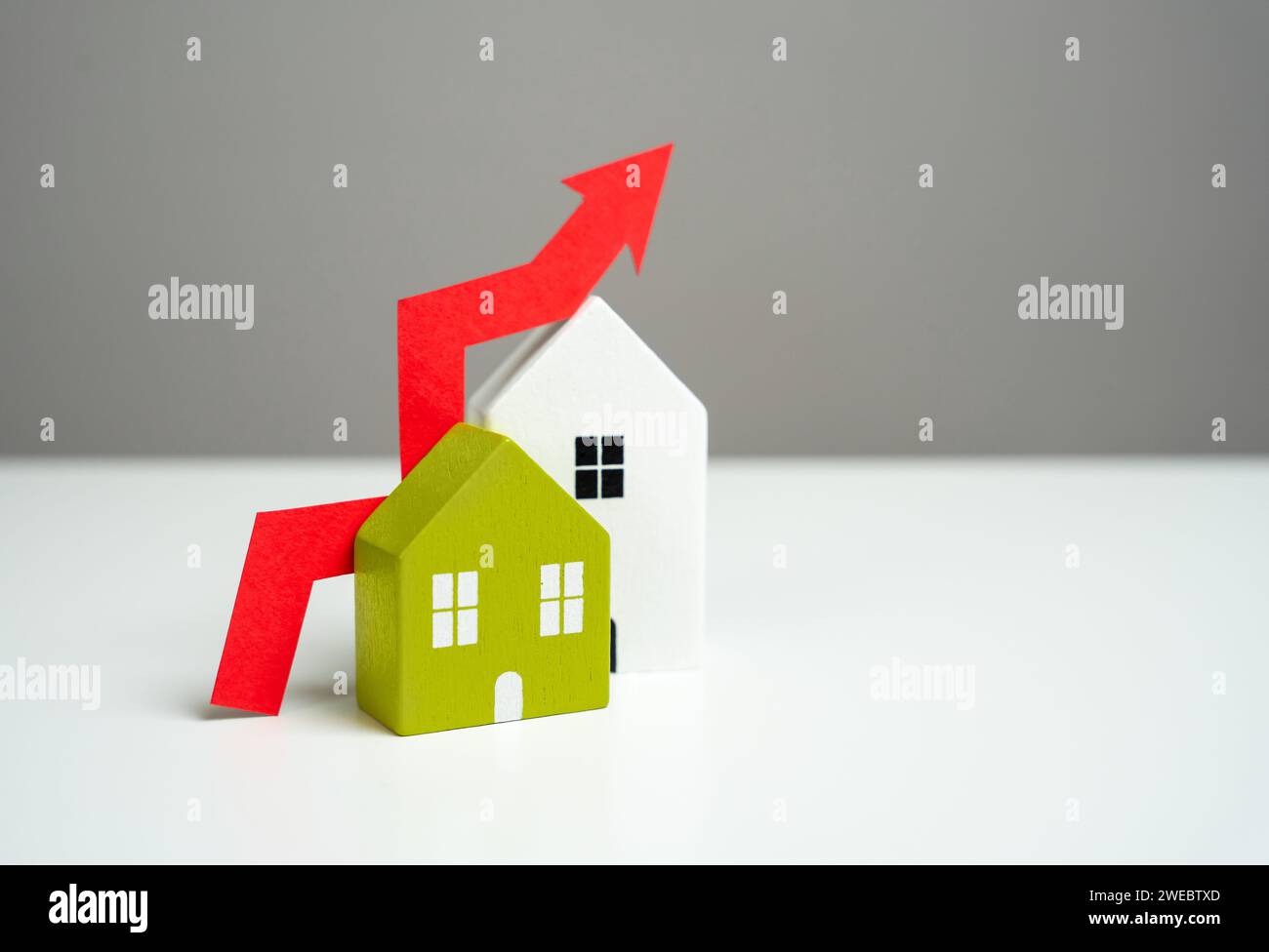 Houses and red arrow up. Growing demand, construction rates and trends ...