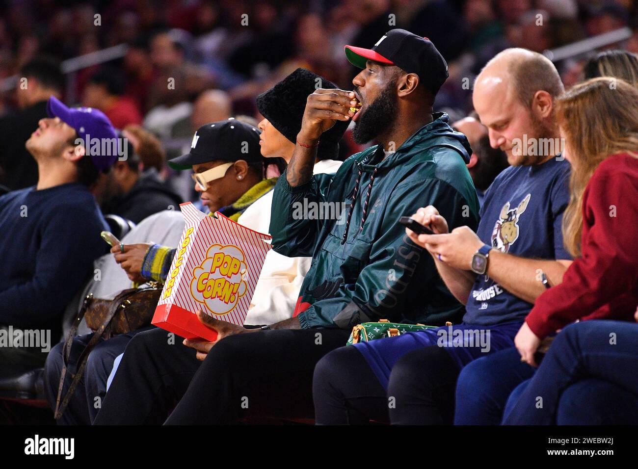 LOS ANGELES, CA - JANUARY 10: Lebron James eats popcorn during the ...