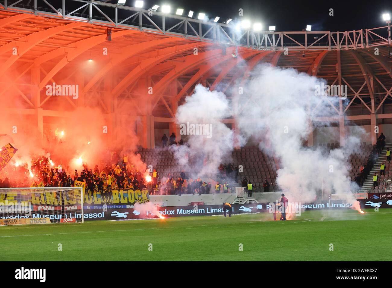 Fans throw flares on the pitch before the Cyprus' cup soccer match ...