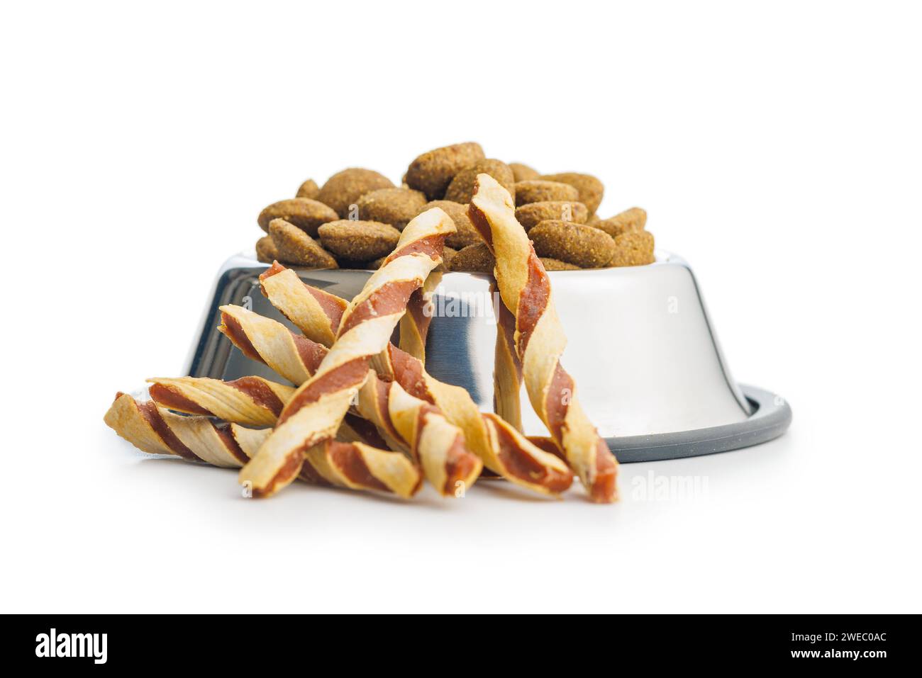 Dog food. Snack sticks for dogs in bowl isolated on the white ...