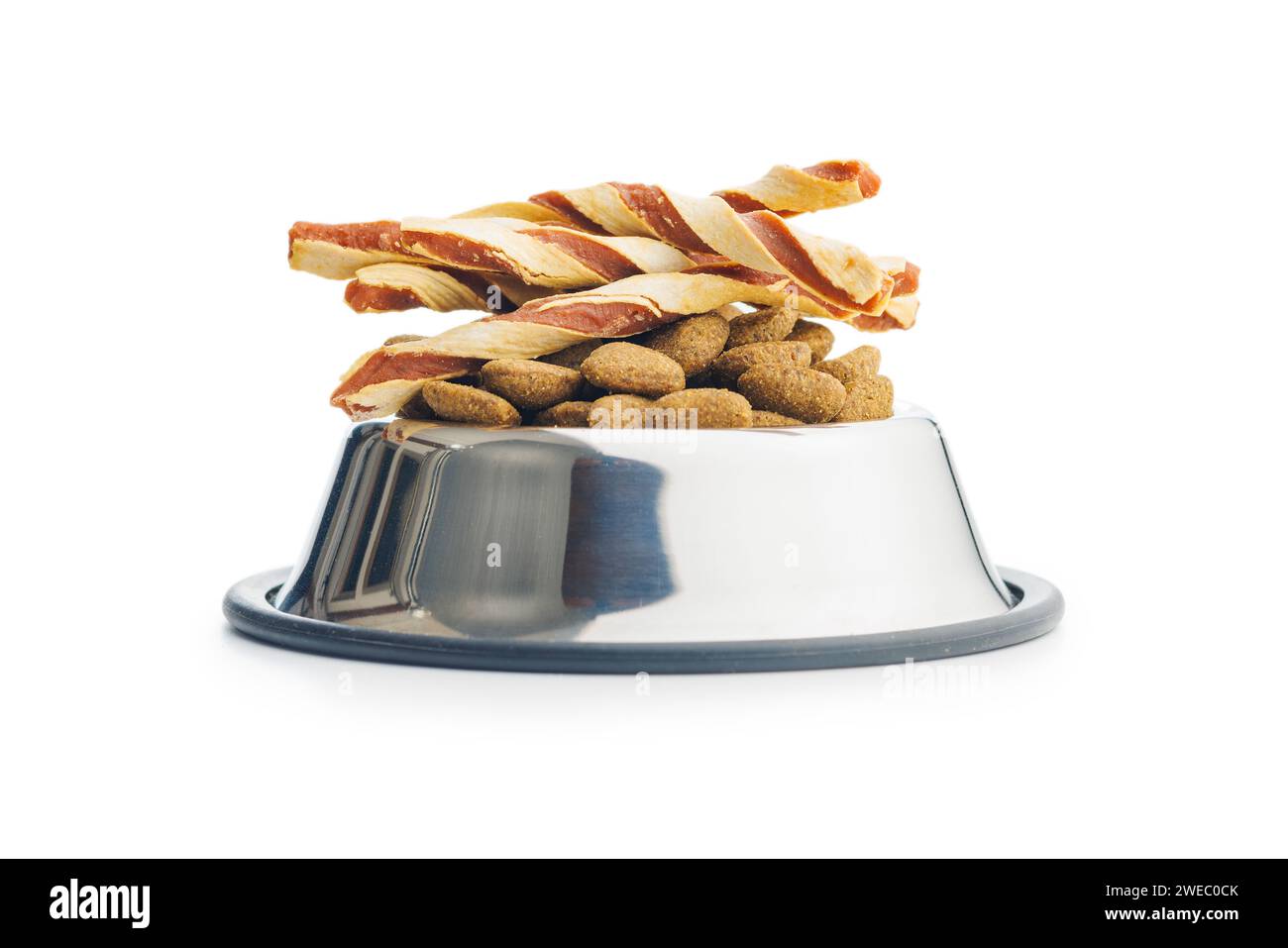 Dog food. Snack sticks for dogs in bowl isolated on the white ...