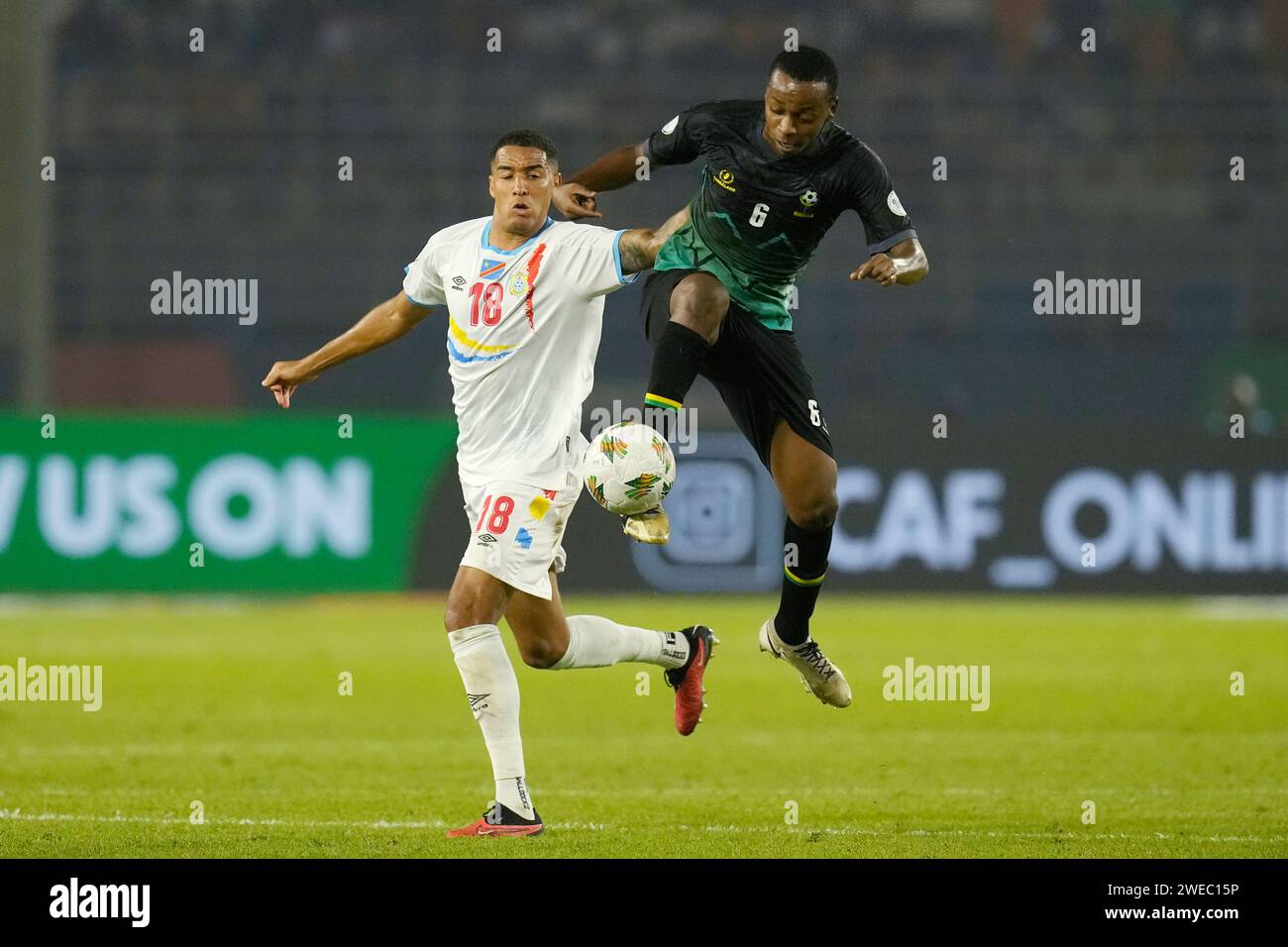 Tanzania's Feisal Salum, right, challenges for the ball with DR Congo's ...