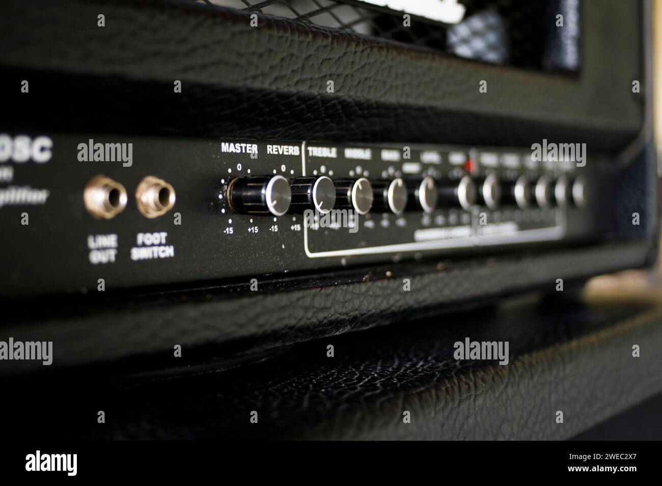 Close up electric guitar amplifier. Master regulator knob, volume level ...