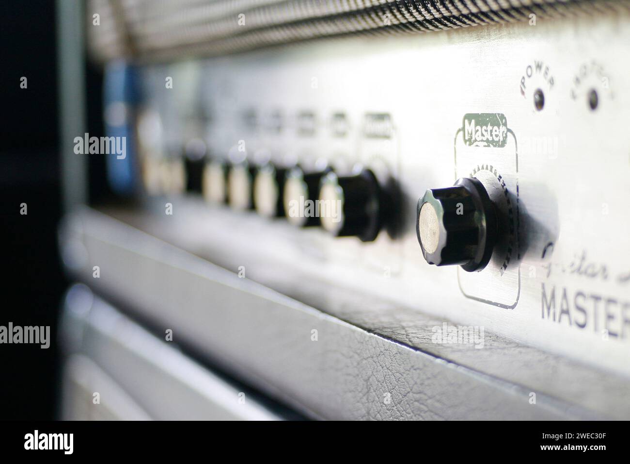 Close up electric guitar amplifier. Master regulator knob, volume level ...