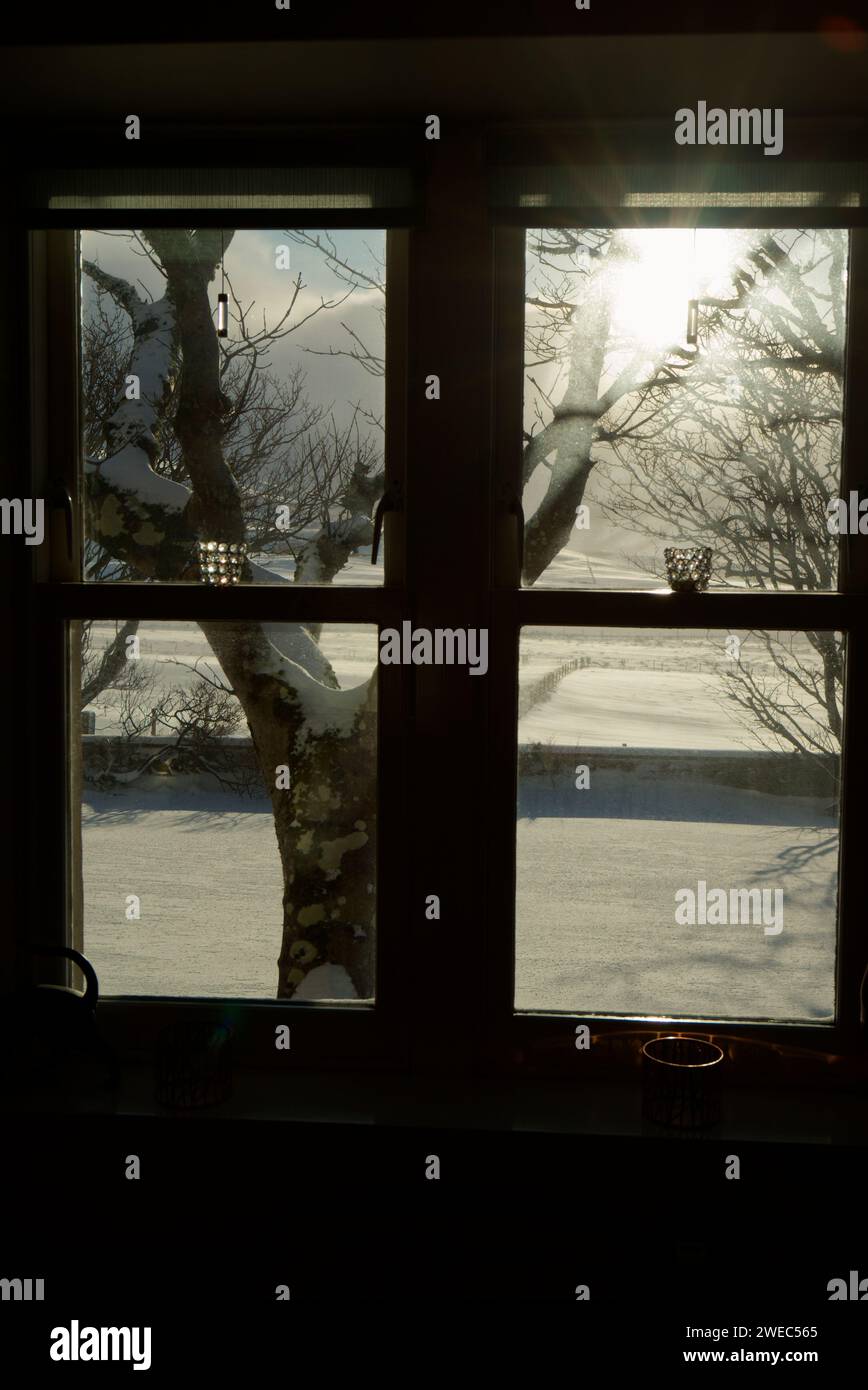 Winter sunlight shining through window in cottage Stock Photo - Alamy
