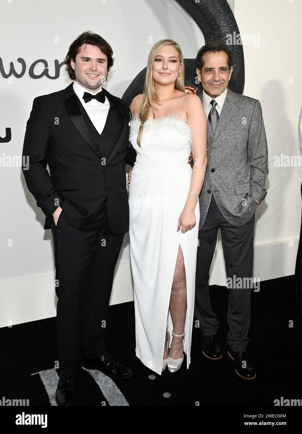 Travel, left, Josie Lynn Adams and Tony Shalhoub attend the premiere of ...