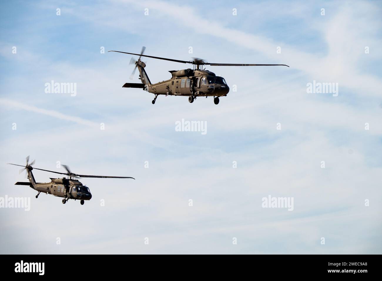 Two Sikorsky UH-60 Black Hawk's fly above a Combined Arms Live Fire ...