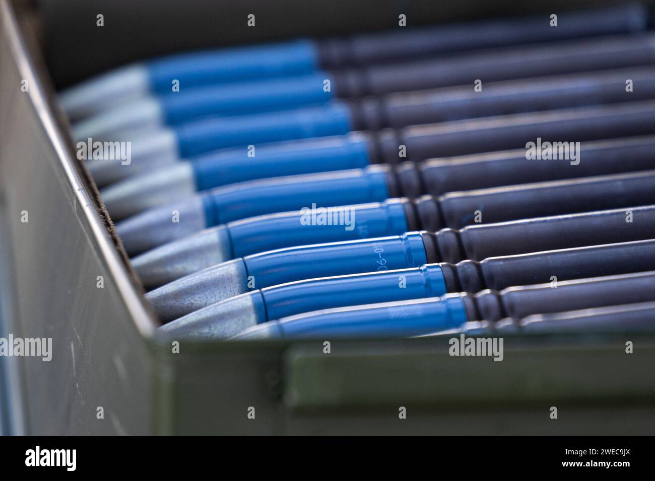 An ammunition canister filled with 30-millimeter rounds sits on standby ...