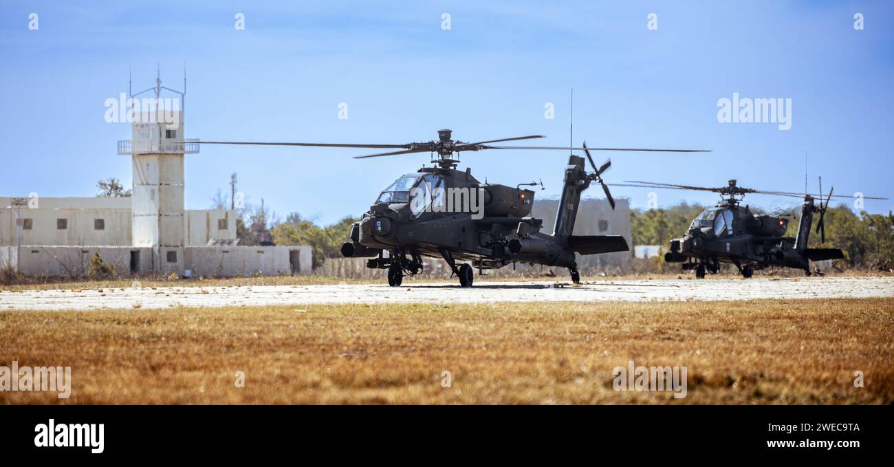 U.S. Army AH-64E Apache helicopters standby for refueling at Marine ...