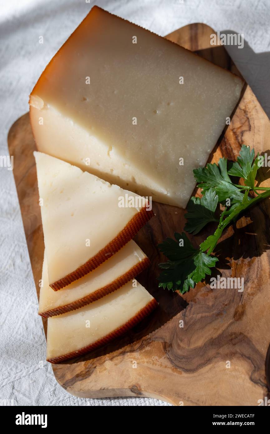 Spanish hard manchego, cow, sheep and goat cheese close up Stock Photo ...