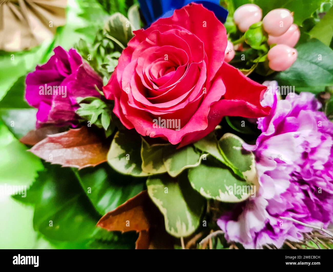Colorful bouquet with roses, carnations and St. John's wort Stock Photo ...