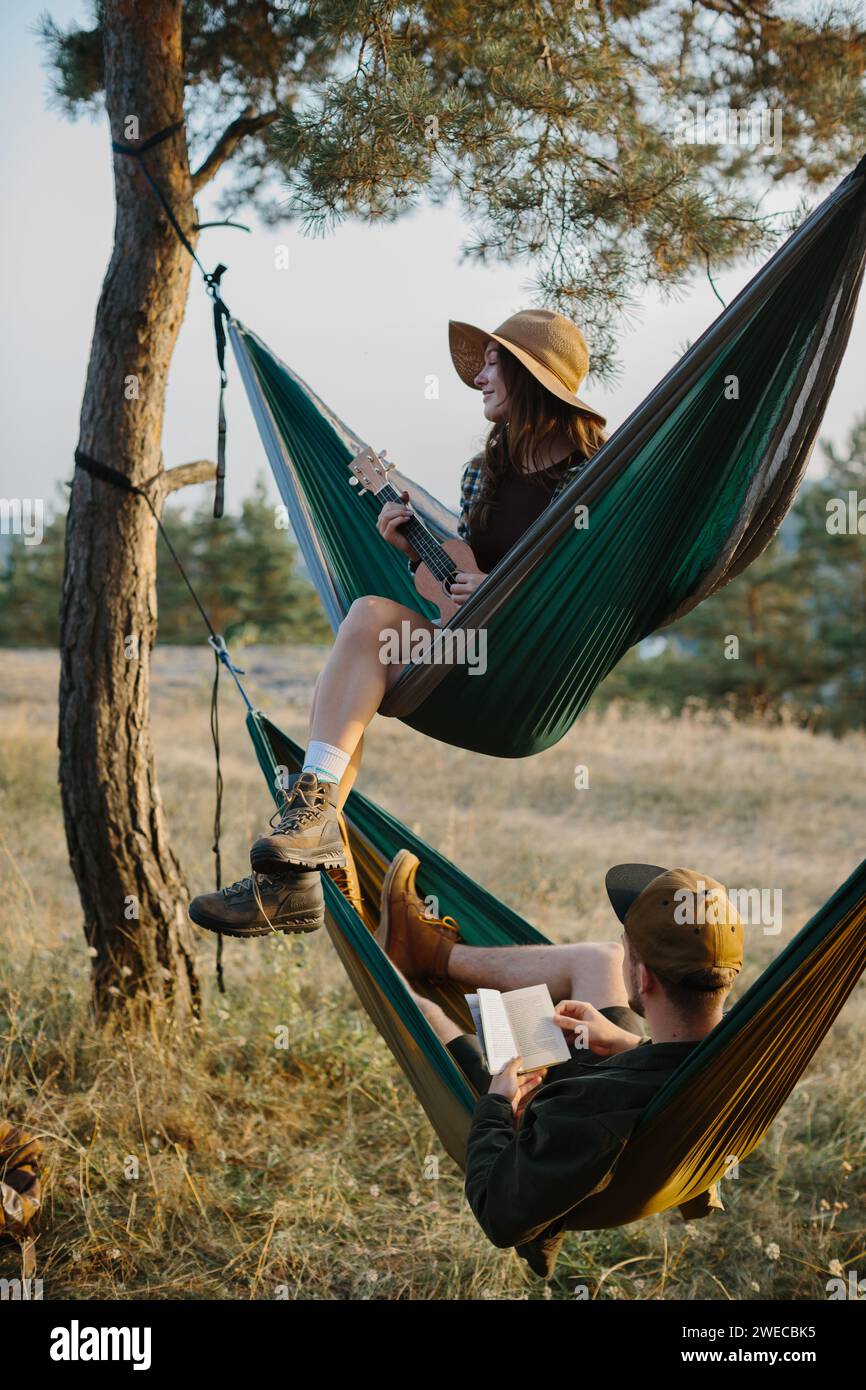 Aesthetic rest. A beautiful young girl and her boyfriend are relaxing ...