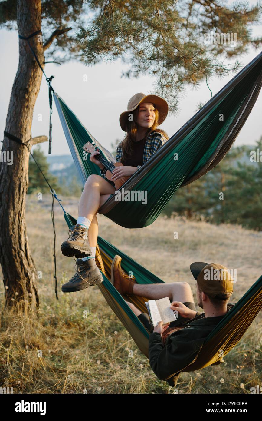 Aesthetic rest. A beautiful young girl and her boyfriend are relaxing ...