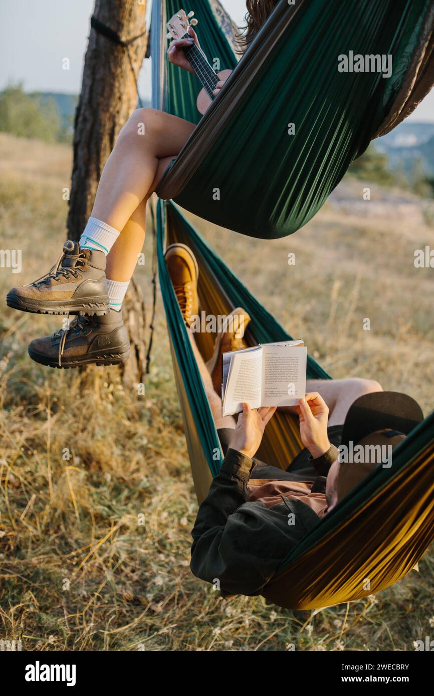 Aesthetic rest. A beautiful young girl and her boyfriend are relaxing ...