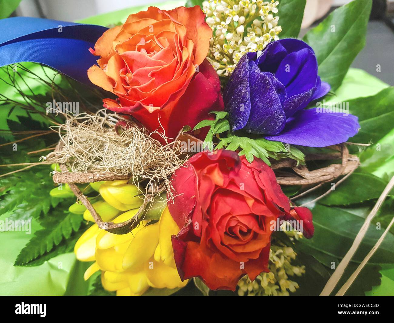 Colorful bouquet with roses, freesias and ranunculus Stock Photo - Alamy
