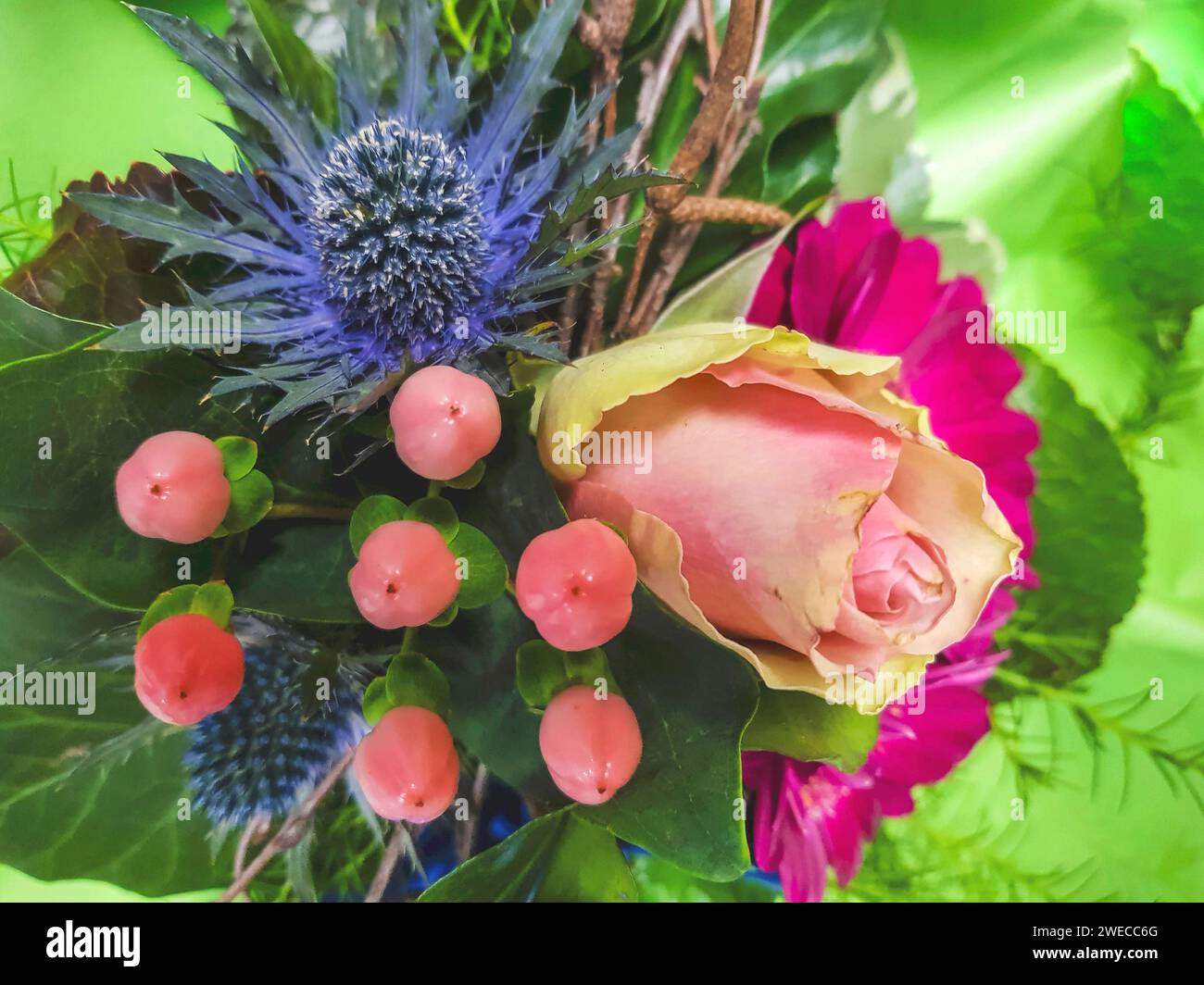 Colorful bouquet of flowers with St. John's wort, roses and eryngo ...