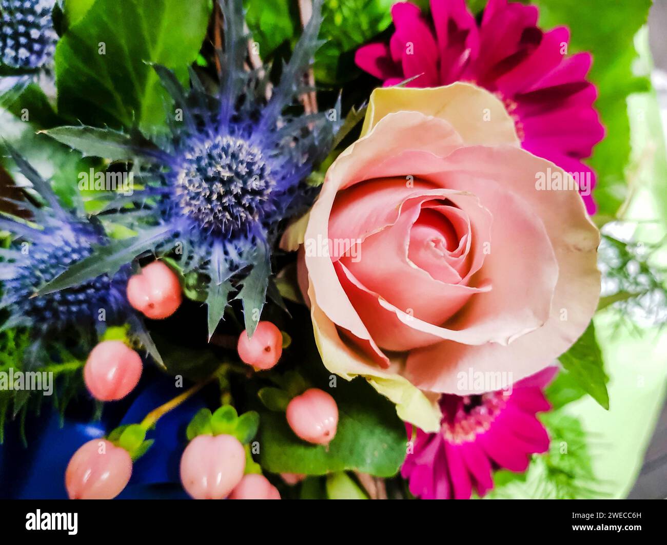 Colorful bouquet of flowers with St. John's wort, roses and eryngo ...