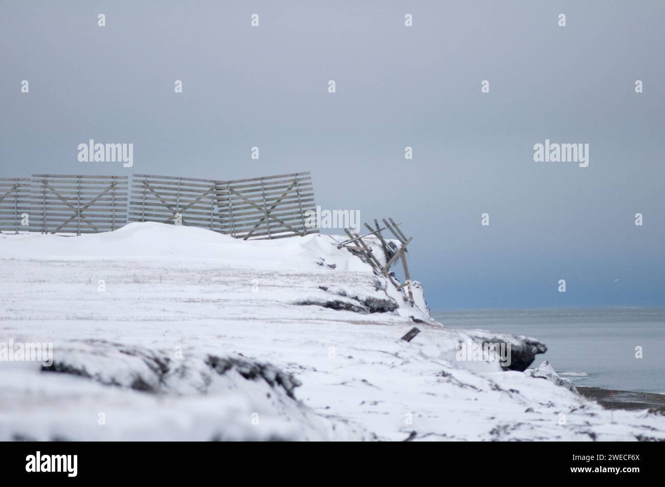 erosion due to melting permafrost, rising sea levels, and pounding surf ...