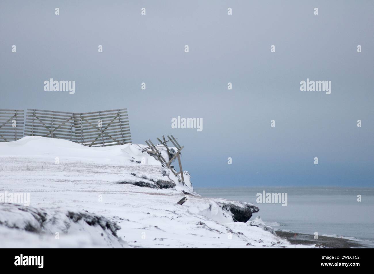 erosion due to melting permafrost, rising sea levels, and pounding surf ...