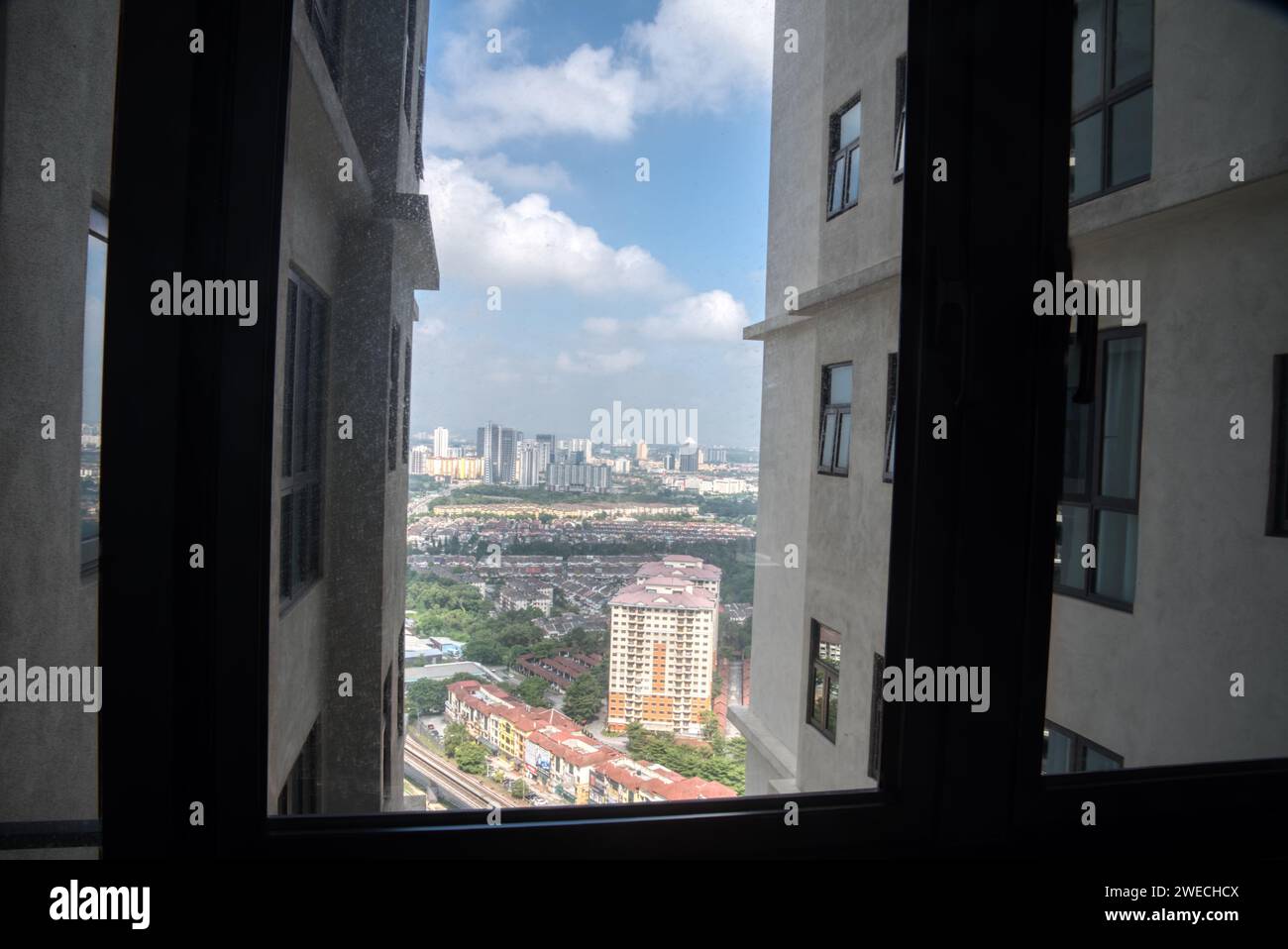 looking out from interior windows toward the urban city landscape scene ...
