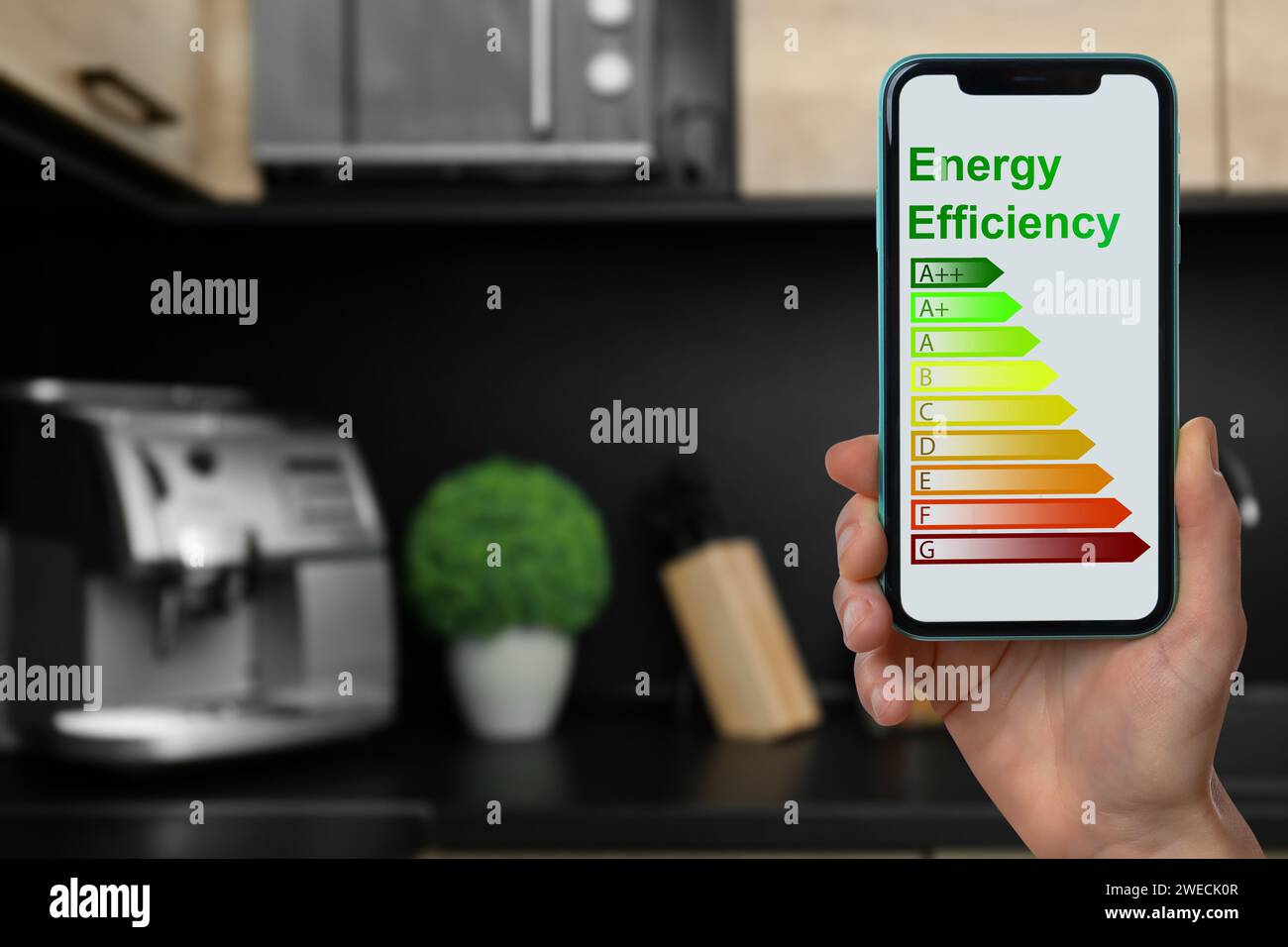 Energy efficiency. Woman using smartphone with colorful rating on ...